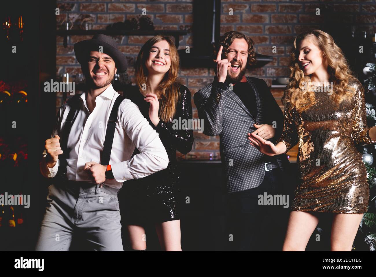 They love dancing. Group of beautiful young people dancing with ...