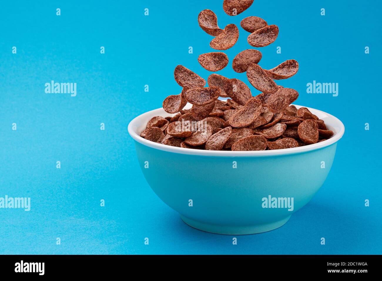 Falling chocolate corn flakes, healthy breakfast Stock Photo - Alamy