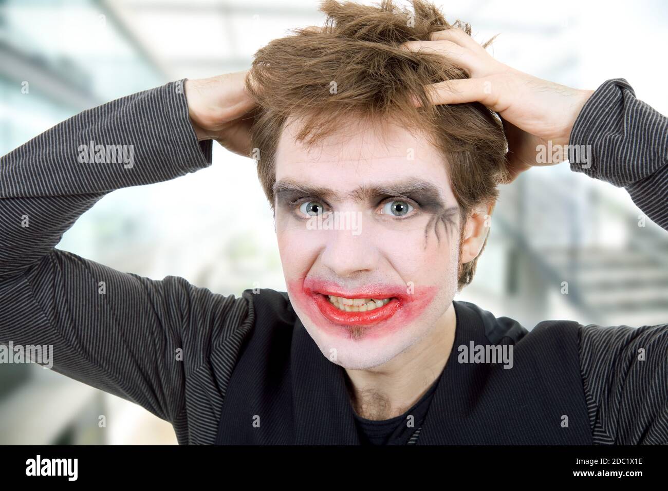 crazy young man dressed as joker Stock Photo - Alamy