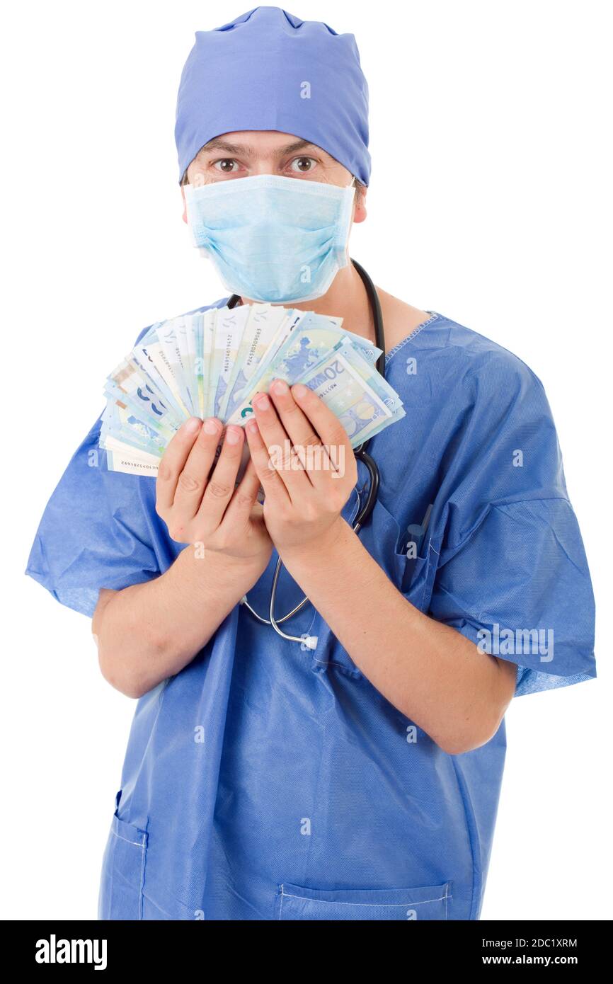 Happy male doctor holding bank notes, isolated Stock Photo - Alamy