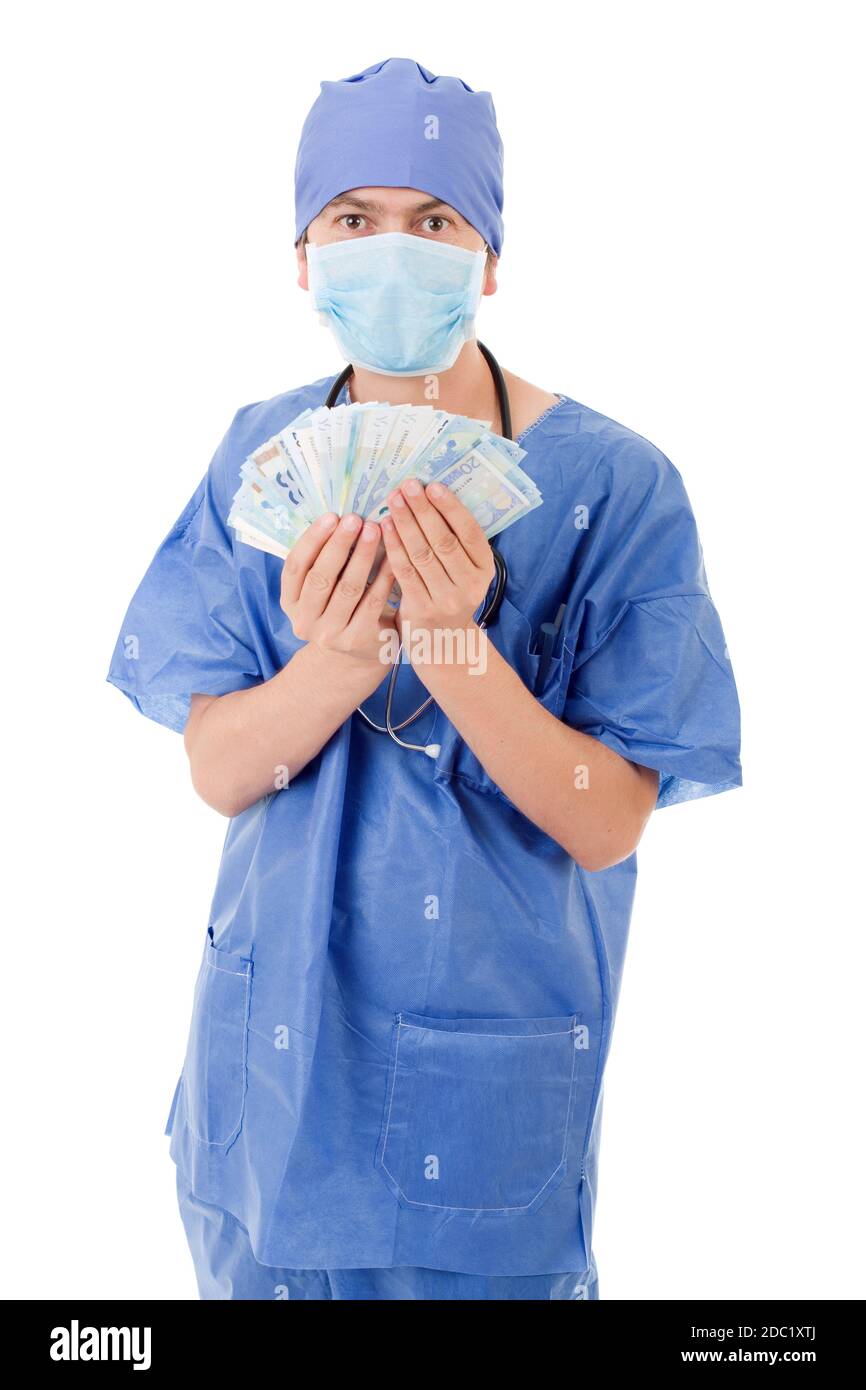 Happy male doctor holding bank notes, isolated Stock Photo - Alamy