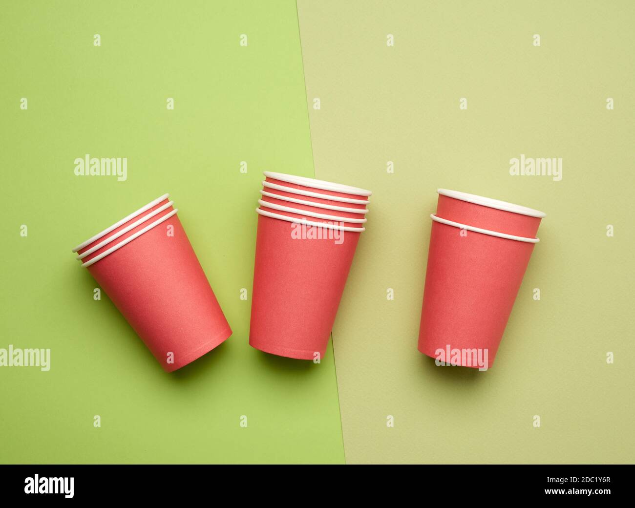 stack of red paper disposable cups on a blue background, flat lay ...