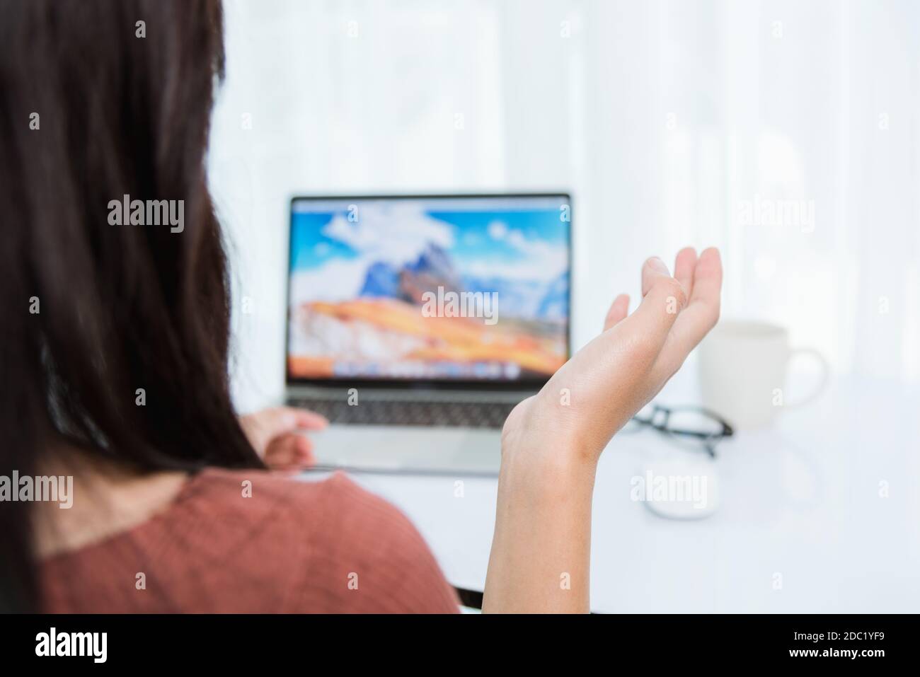 Work from home, Back of Asian young businesswoman video conference call ...