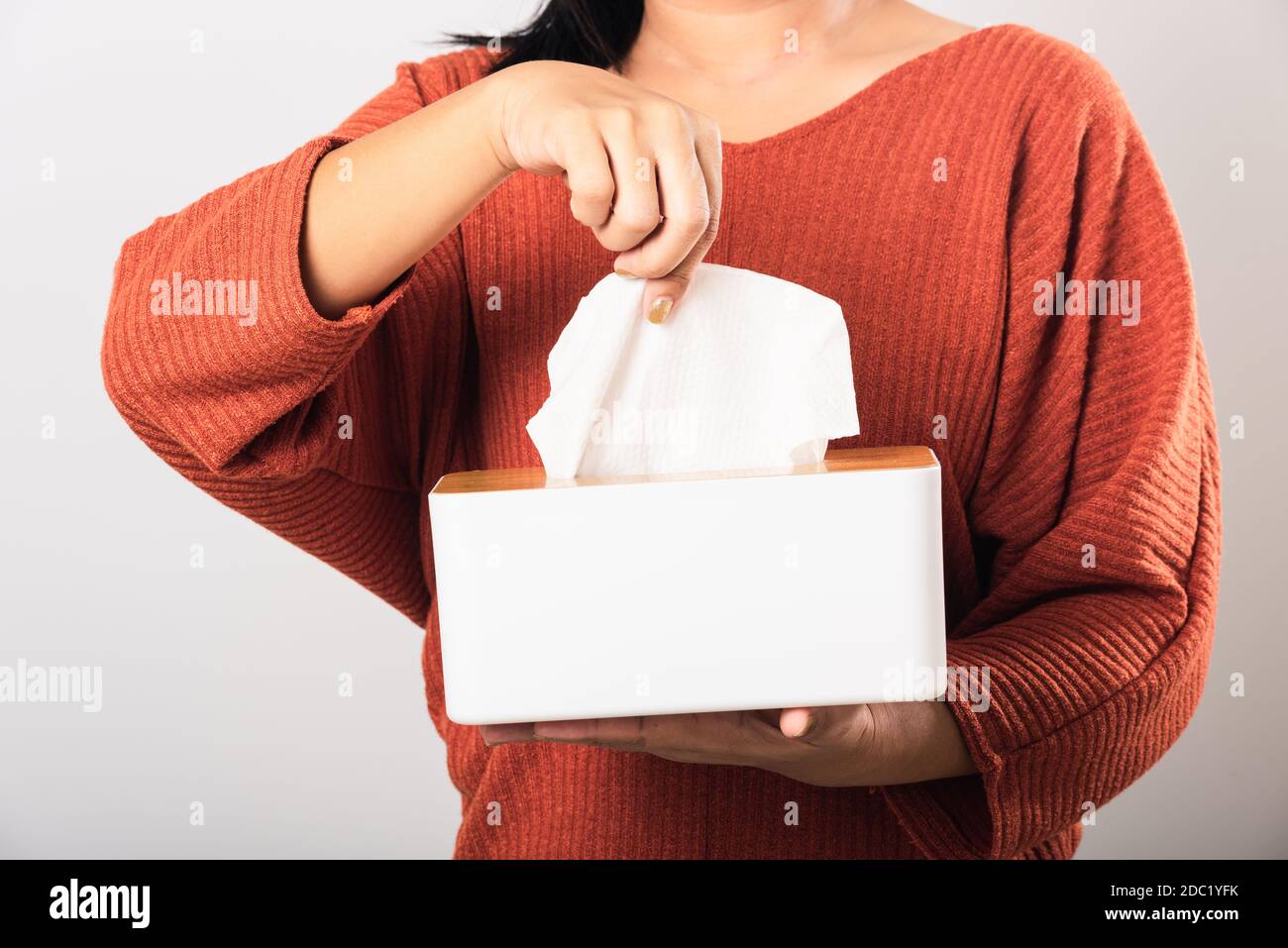 Young woman flu she using hand taking pulling white facial tissue out ...