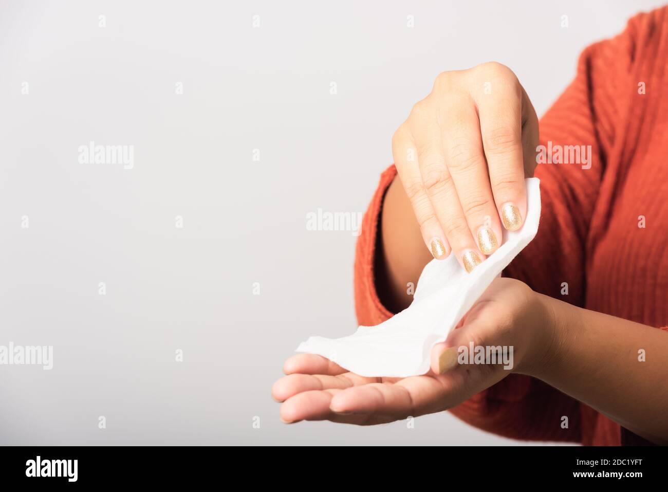 Close up hand of Asian woman she using wet tissue paper wipe cleaning ...