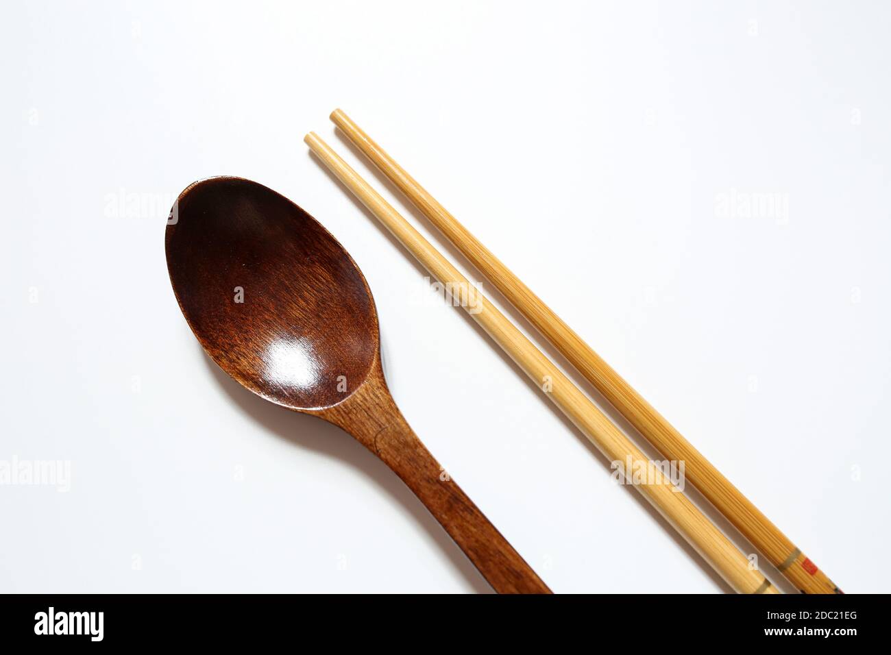 Wooden spoon and chop stick isolated on a white background Stock Photo ...