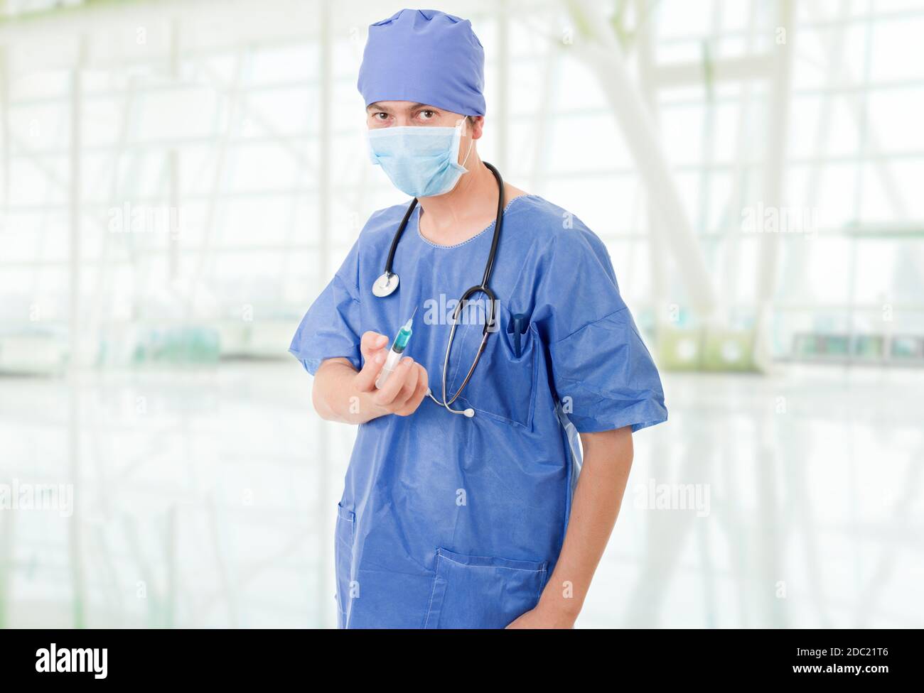 silly doctor with a syringe at the hospital Stock Photo - Alamy