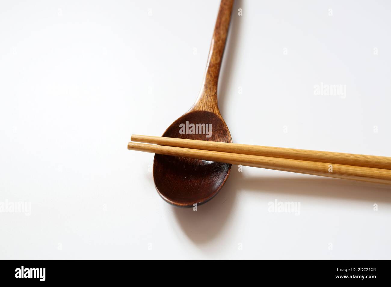 Wooden spoon and chop stick isolated on a white background Stock Photo ...