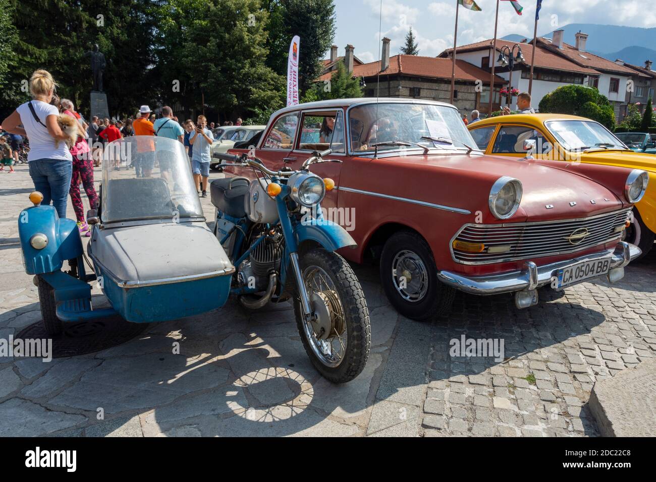 Opel Record veteran vintage car and oldfashioned motorcycle with basket ...