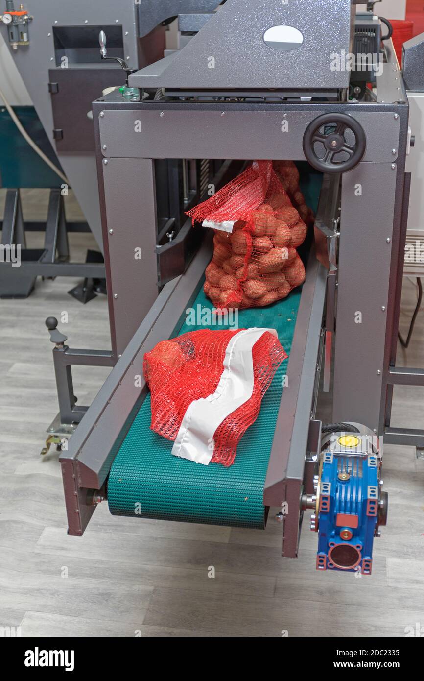 Potato Packing in Sack Bags Conveyor Belt Machine Stock Photo - Alamy