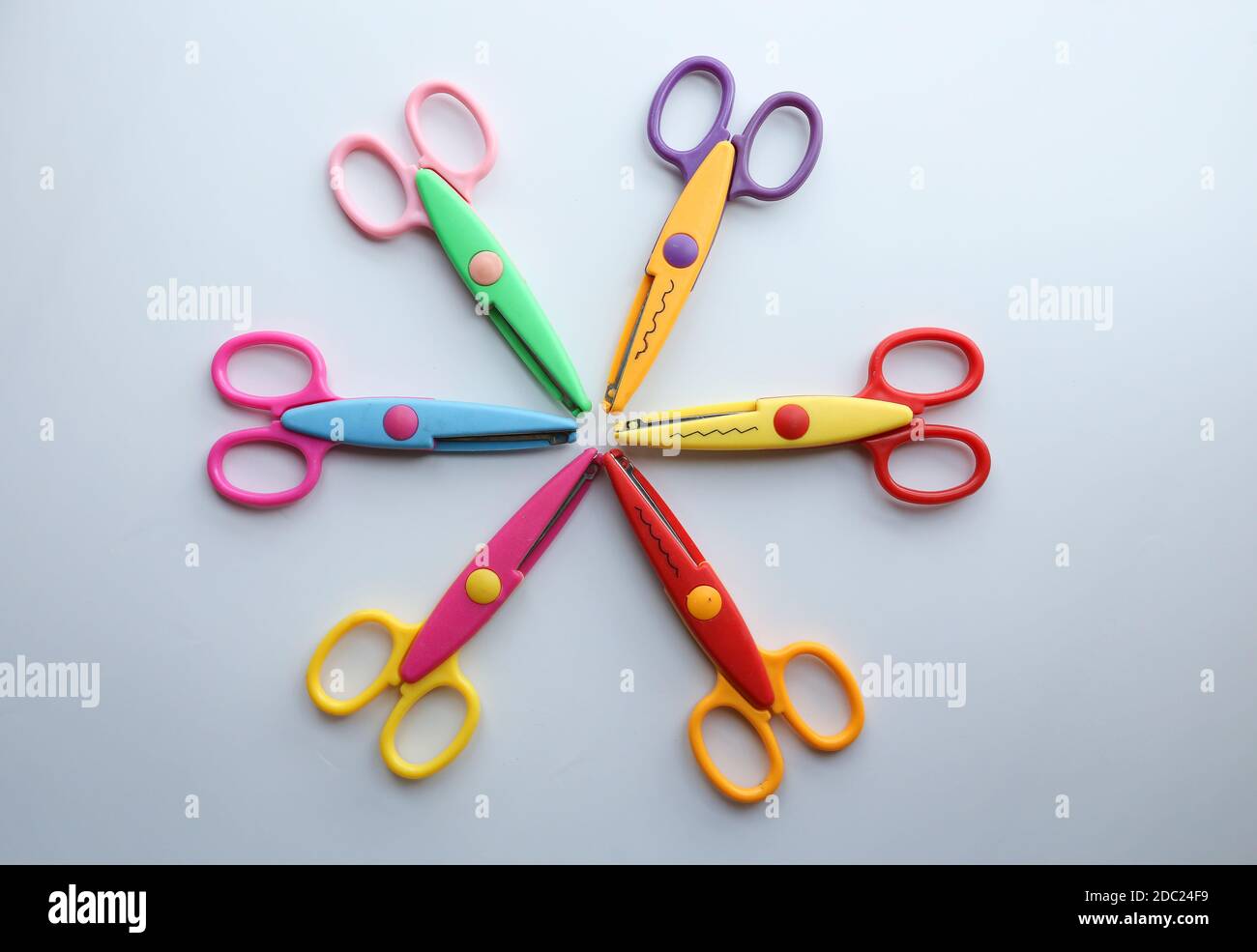 Colorful scissors isolated on a white background Stock Photo - Alamy