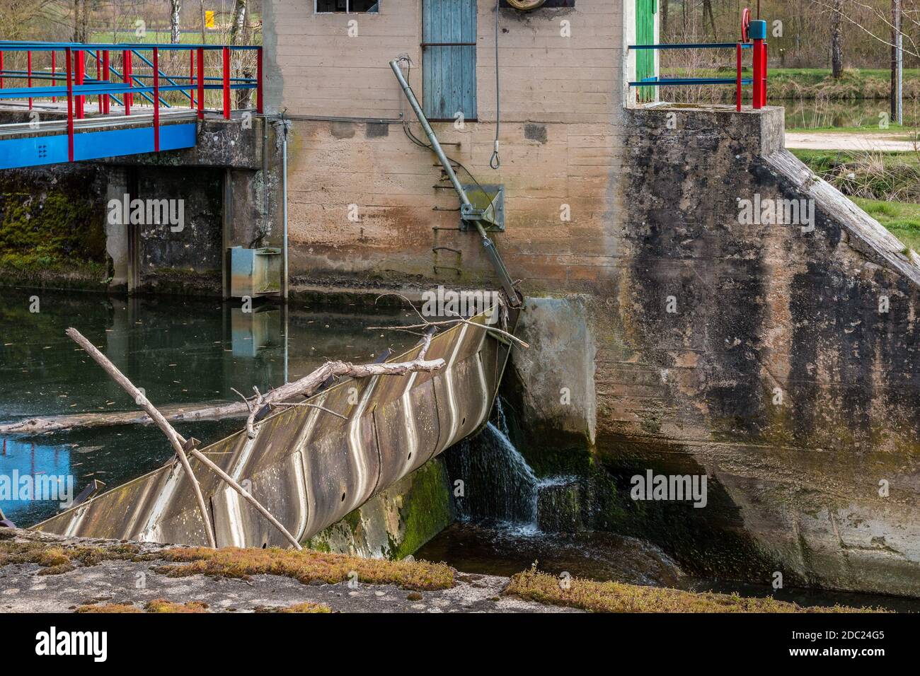Controlled weir by the river to dam the water Stock Photo - Alamy