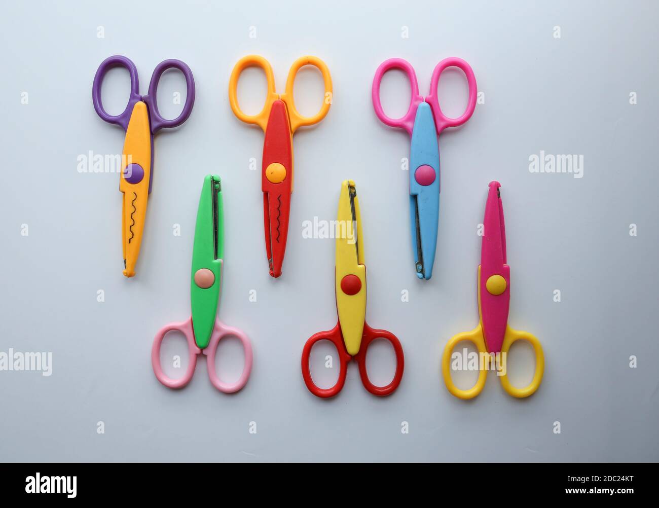 Colorful scissors isolated on a white background Stock Photo - Alamy