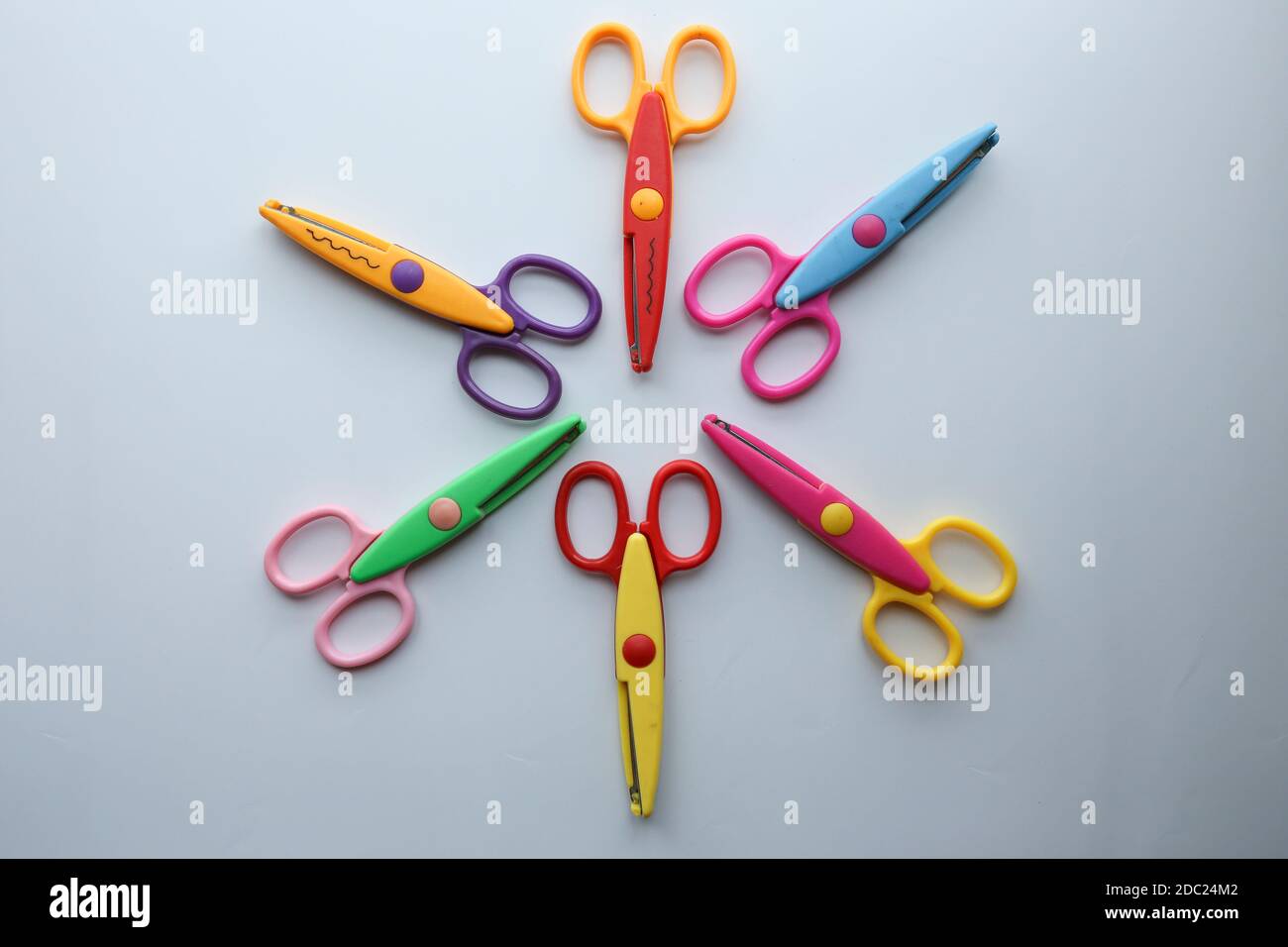 Colorful scissors isolated on a white background Stock Photo - Alamy