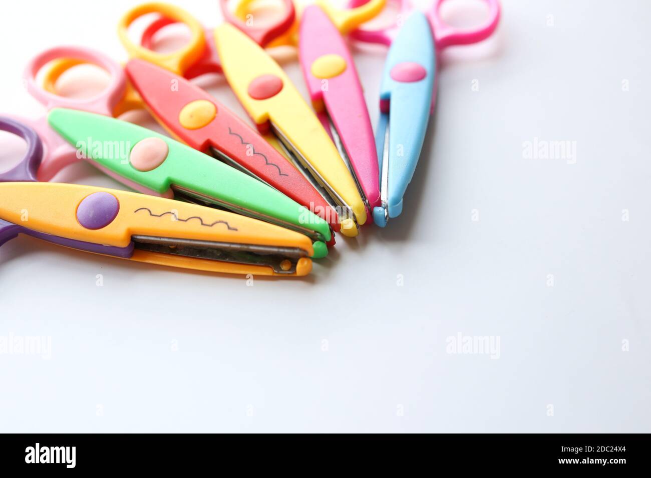 Colorful scissors isolated on a white background Stock Photo - Alamy