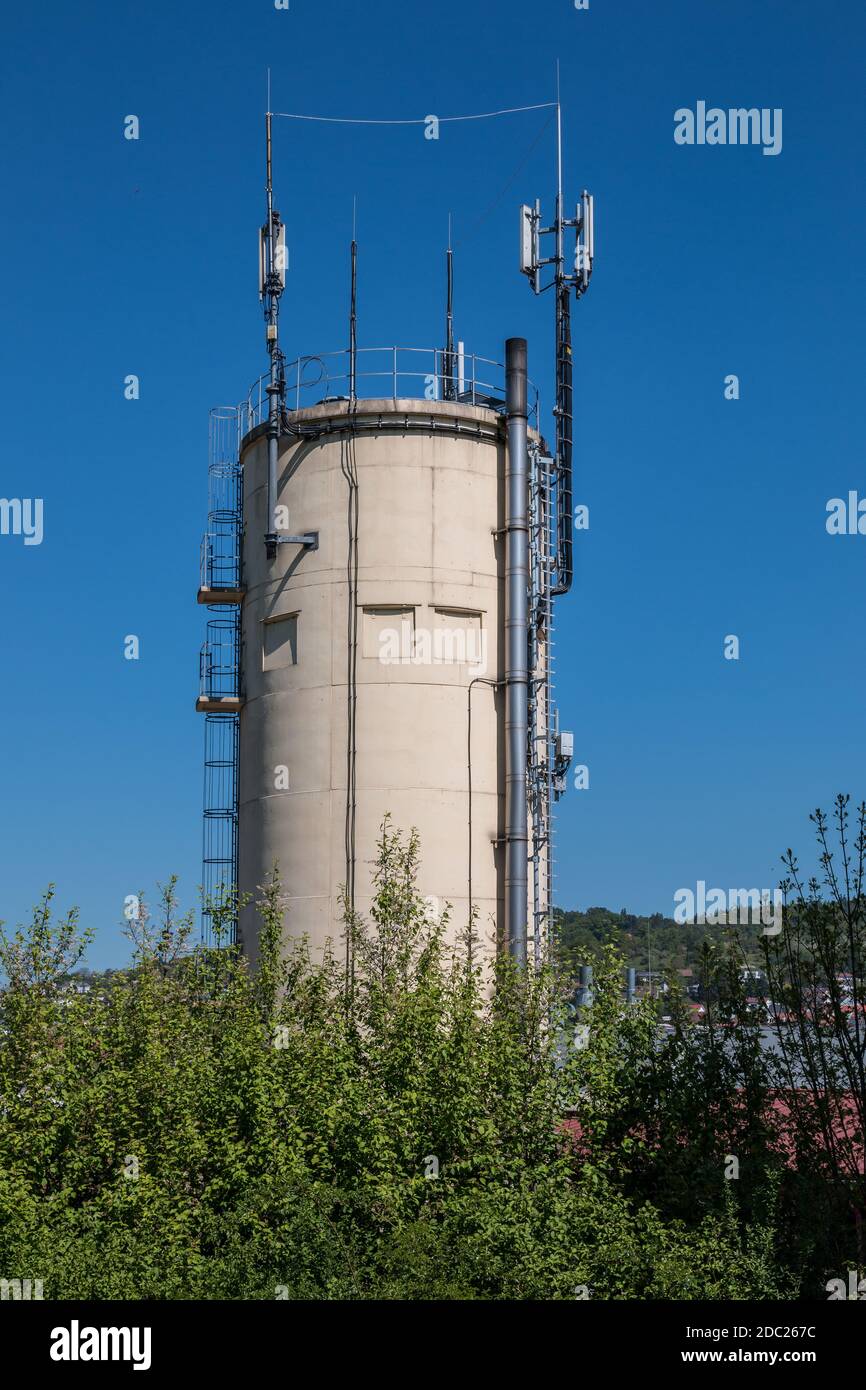 Antennas on a small tower in the center of the town Stock Photo - Alamy