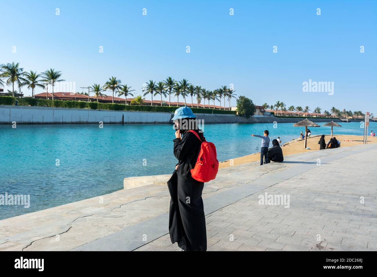 A Female tourist with red backpack wearing hijab in Jeddah Corniche, 30 ...