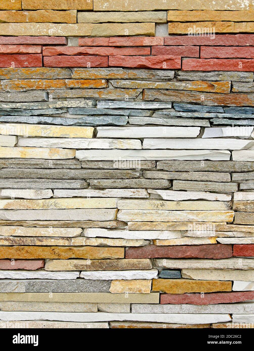 Background image of wall made of colorful stone tiles Stock Photo - Alamy