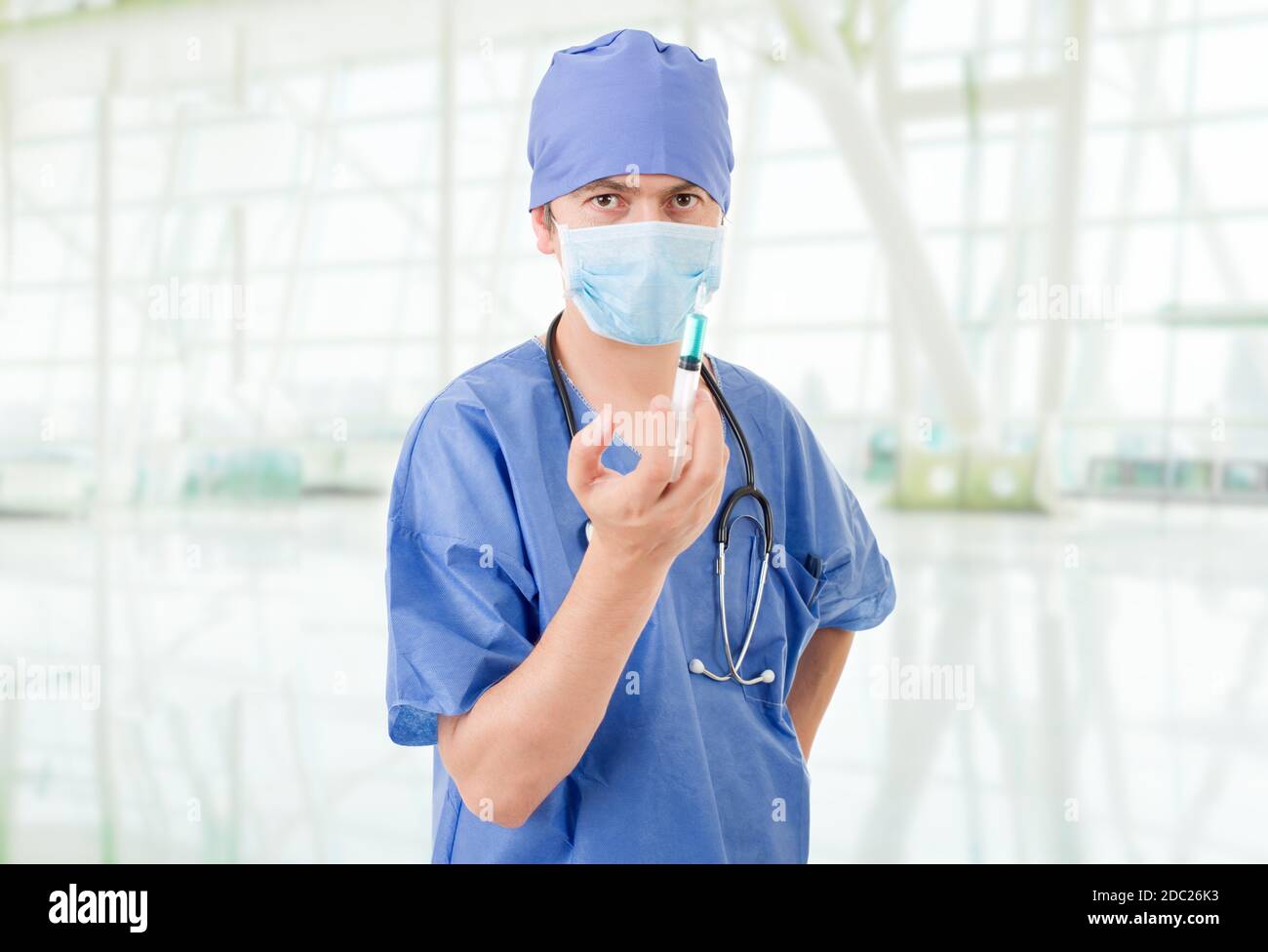 silly doctor with a syringe at the hospital Stock Photo - Alamy