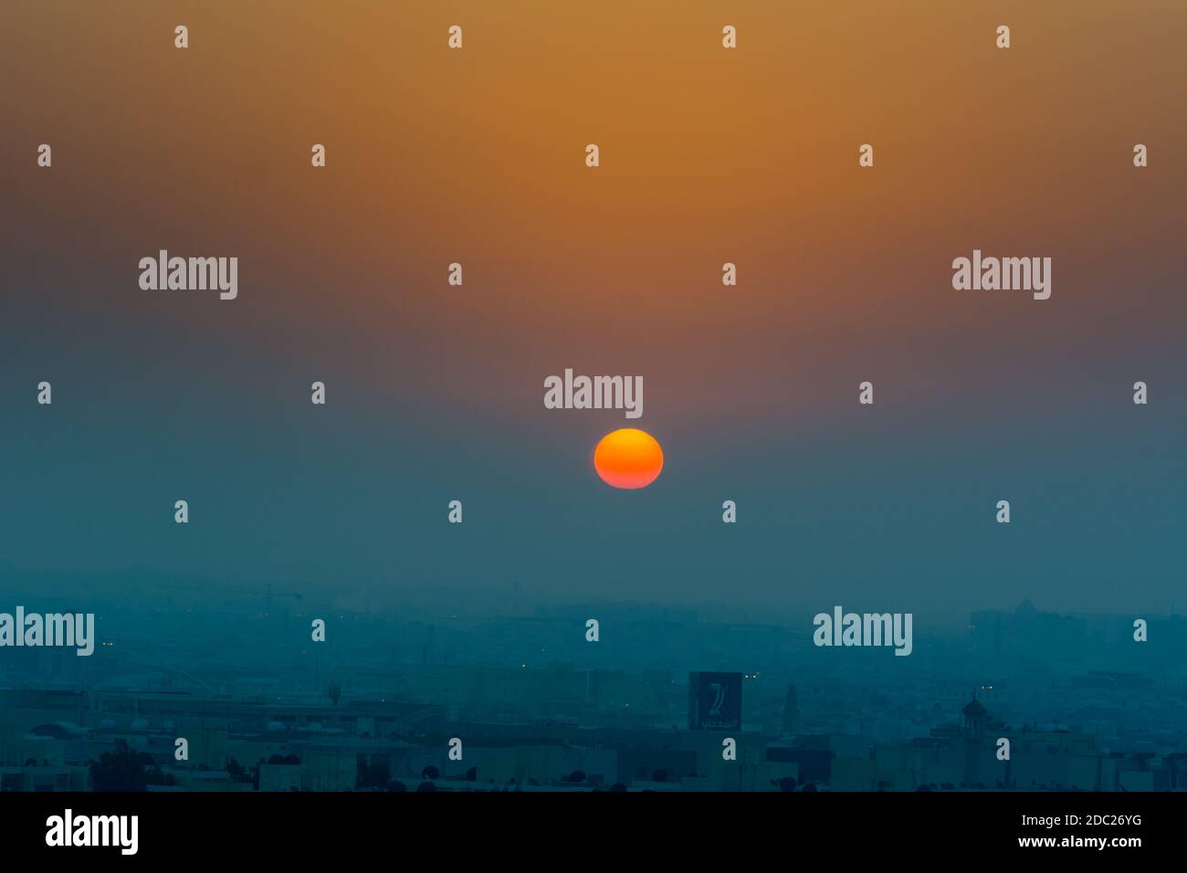 Sun rising in the Dawn of Riyadh with buildings in the downtown of ...