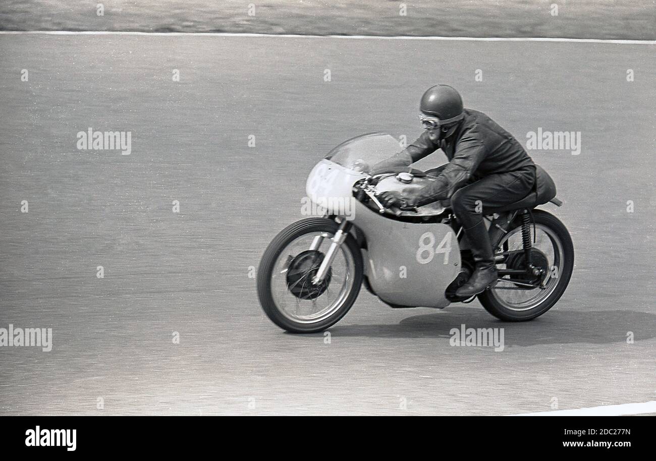 1960s, historical picture of a racing motor cyclist in black leathers ...