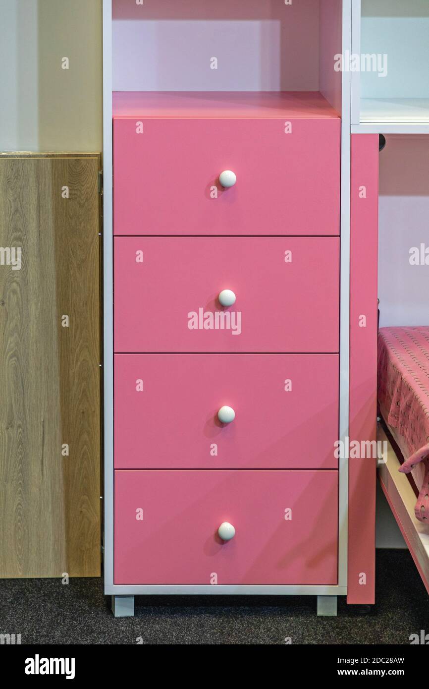 Pink Drawers Cabinet Furniture in Girls Room Stock Photo - Alamy