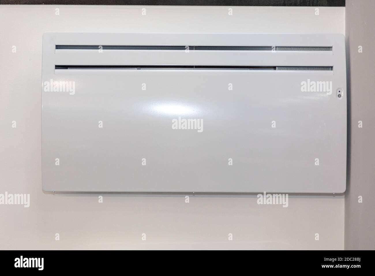 White Electric Heater Radiator at Office Wall Stock Photo - Alamy