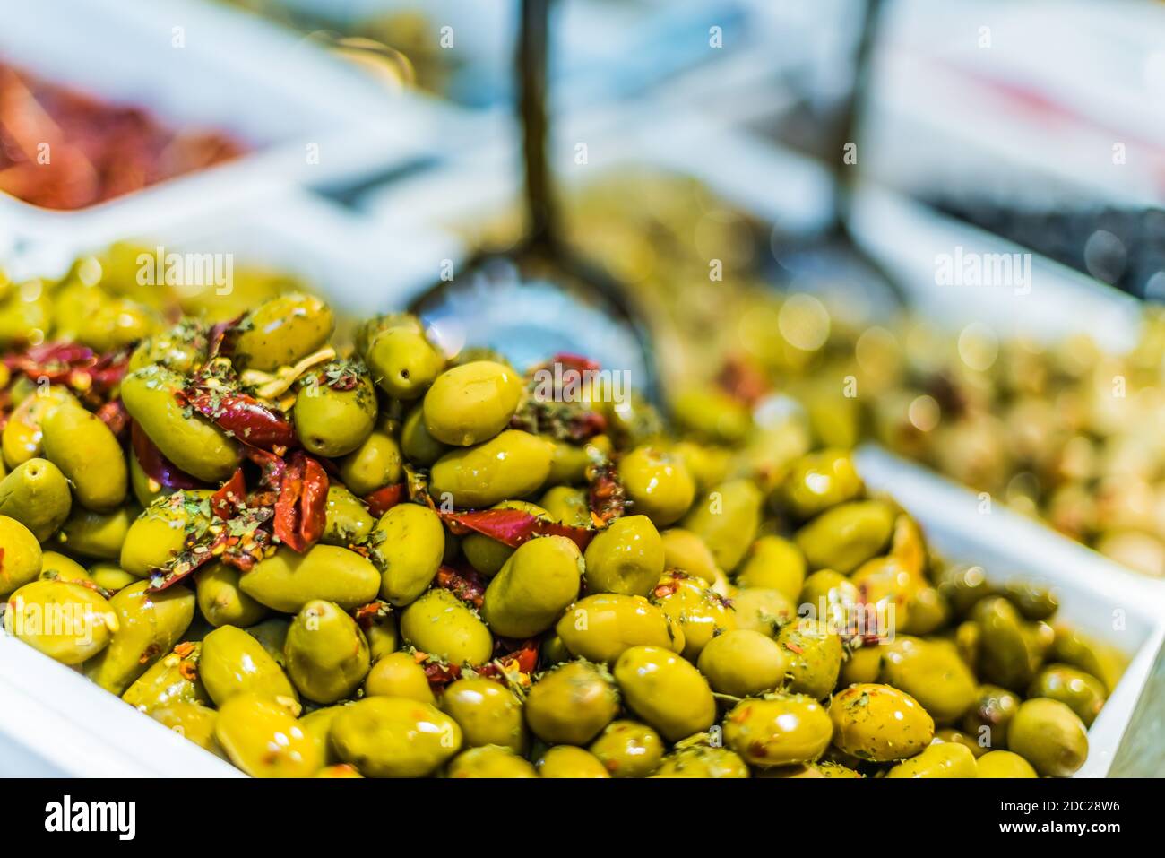 Assorted olives put up for sale on the italian street market stall ...