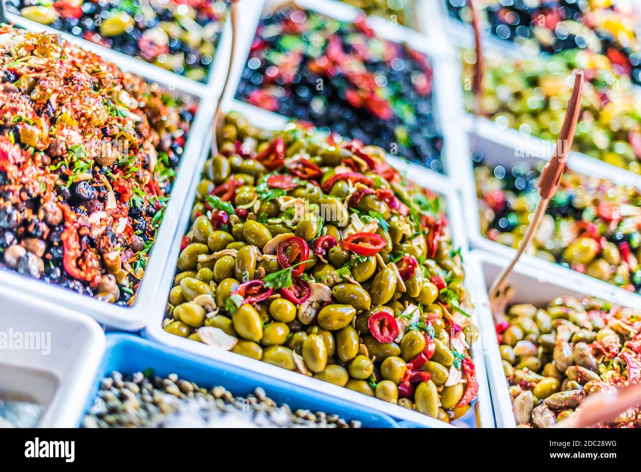 Assorted olives put up for sale on the italian street market stall ...