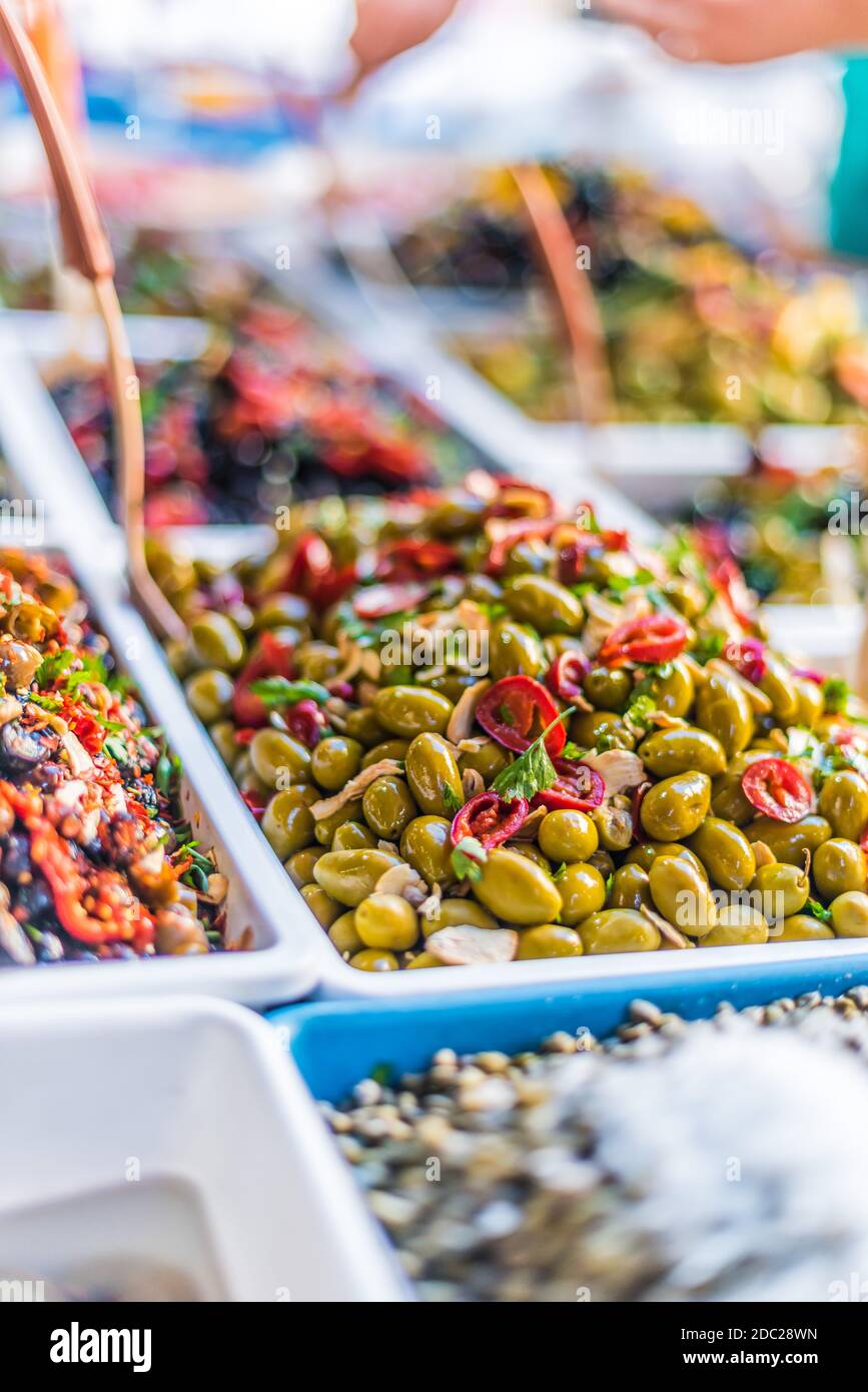 Assorted olives put up for sale on the italian street market stall ...