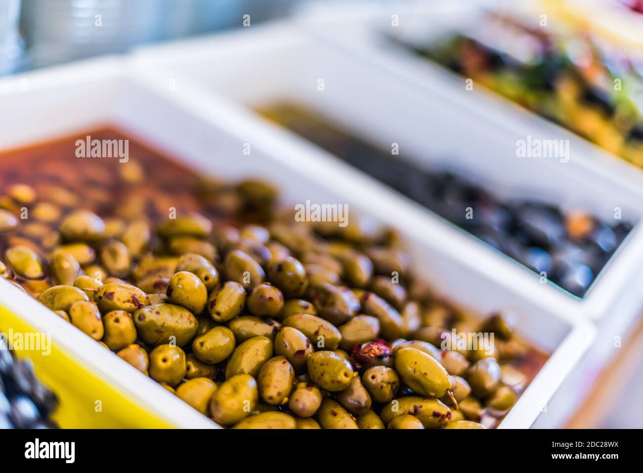 Assorted olives put up for sale on the italian street market stall ...