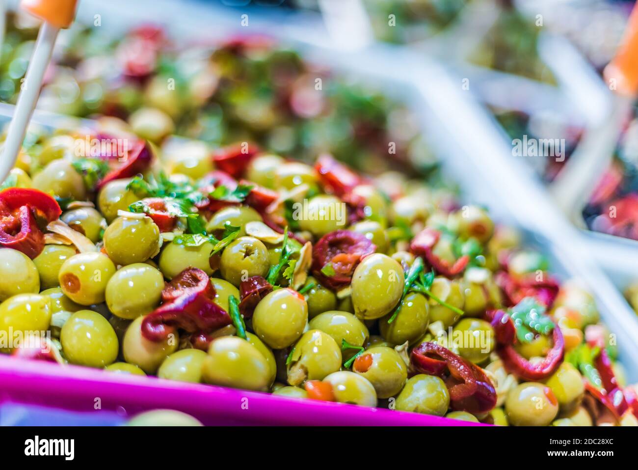 Assorted olives put up for sale on the italian street market stall ...