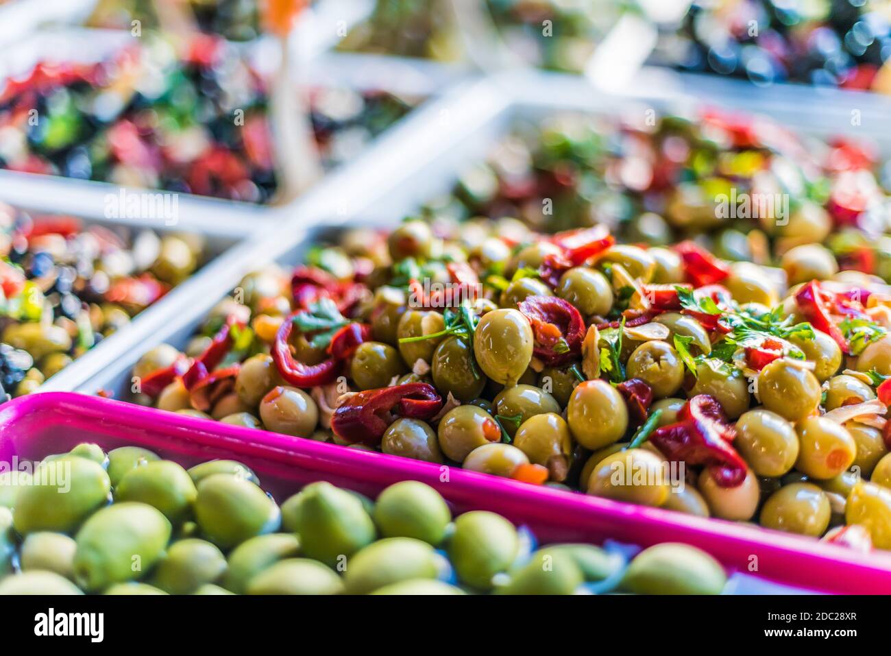 Assorted olives put up for sale on the italian street market stall ...