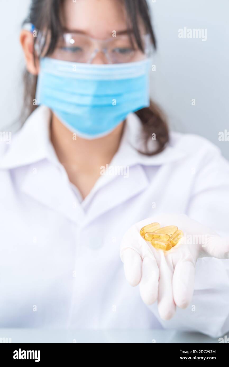 Close up Scientist hands putting in nitrile latex gloves holding Omega ...