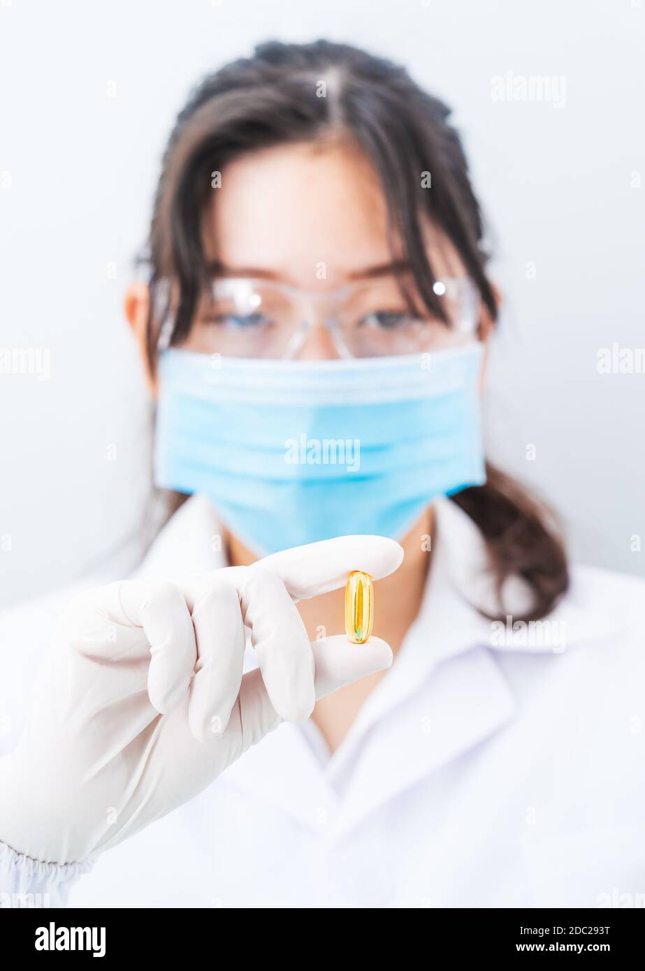 Close up Scientist hands putting in nitrile latex gloves holding Omega ...
