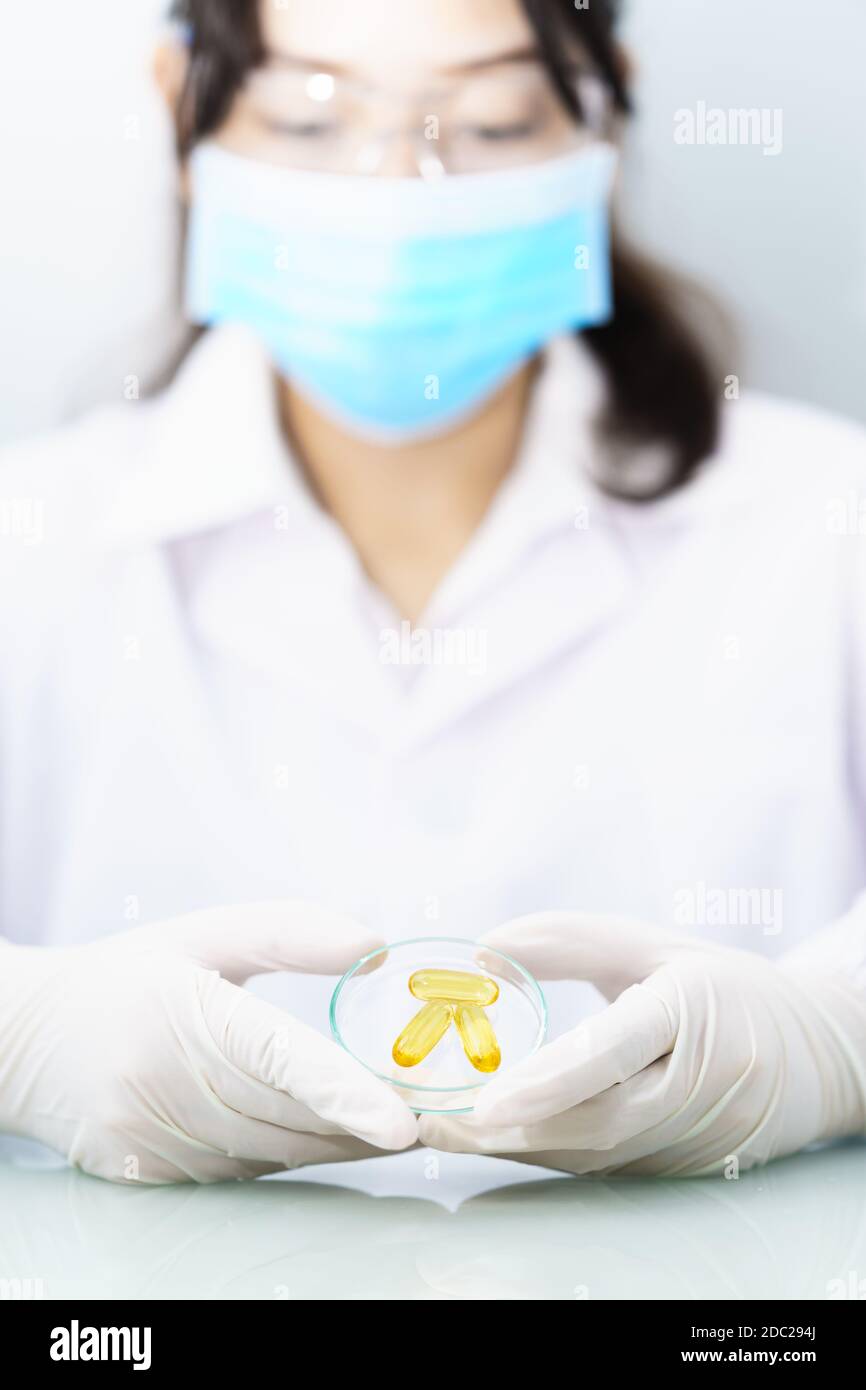 Close up Scientist hands putting in nitrile latex gloves holding Omega ...
