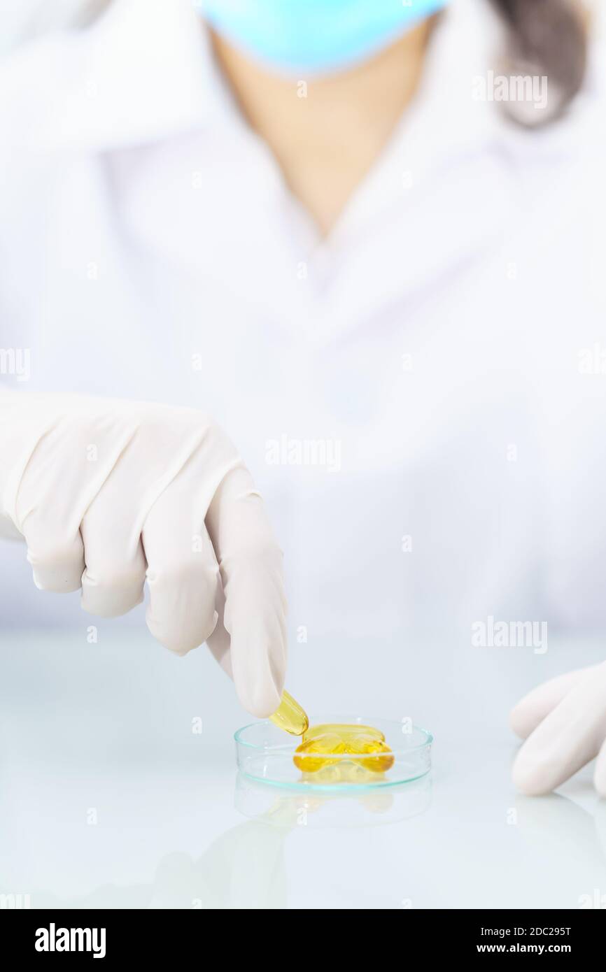 Close up Scientist hands putting in nitrile latex gloves holding Omega ...