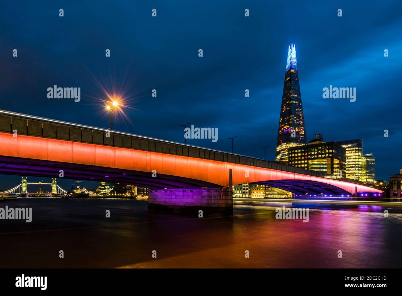 Evening lights over the River Thames at London Bridge and The Shard ...