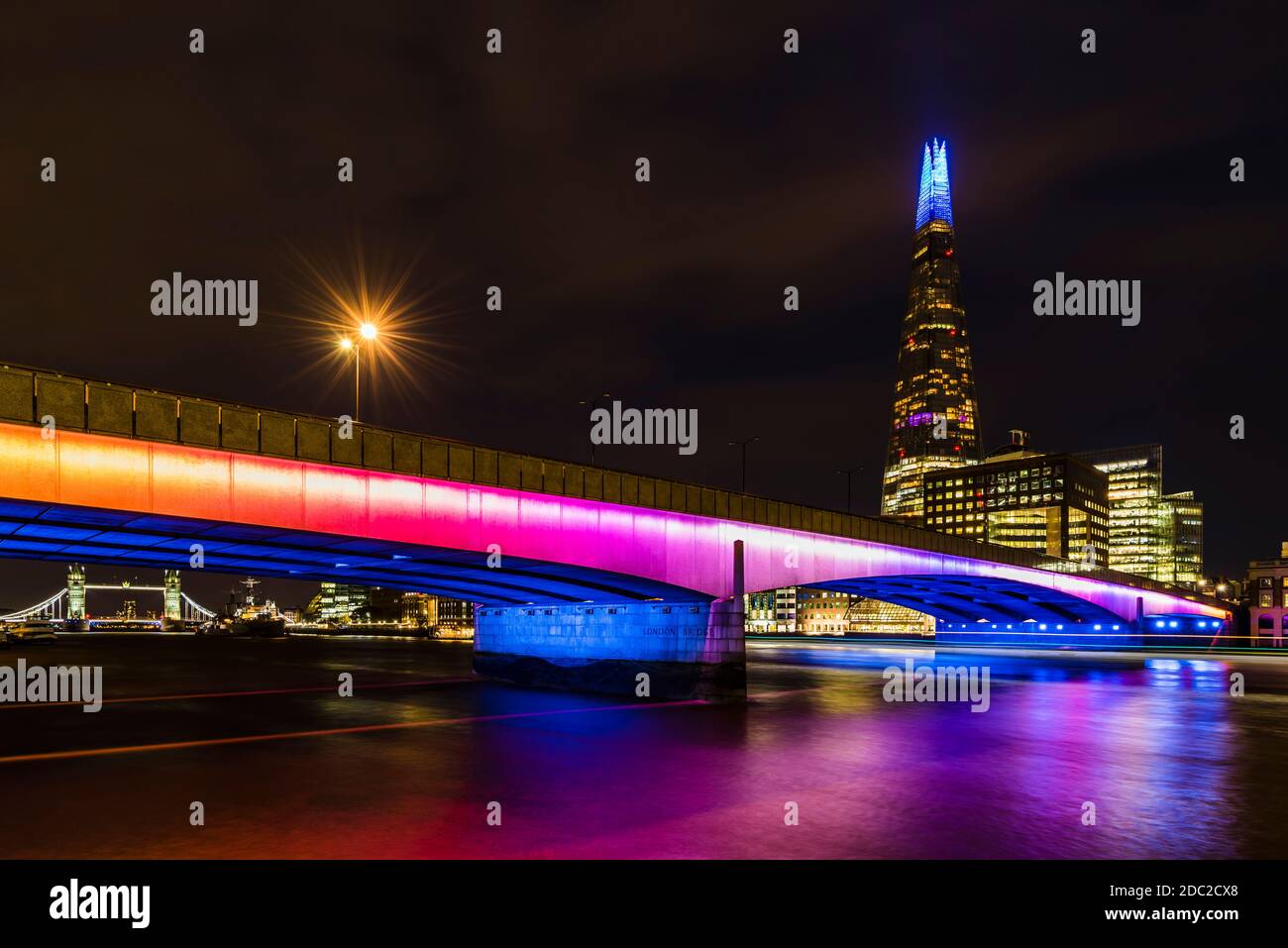 Lights at night over the River Thames at London Bridge and The Shard ...