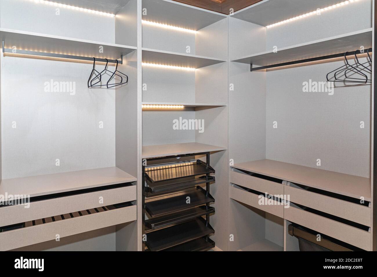 Empty Walk in Wardrobe Closet With Lights Stock Photo - Alamy
