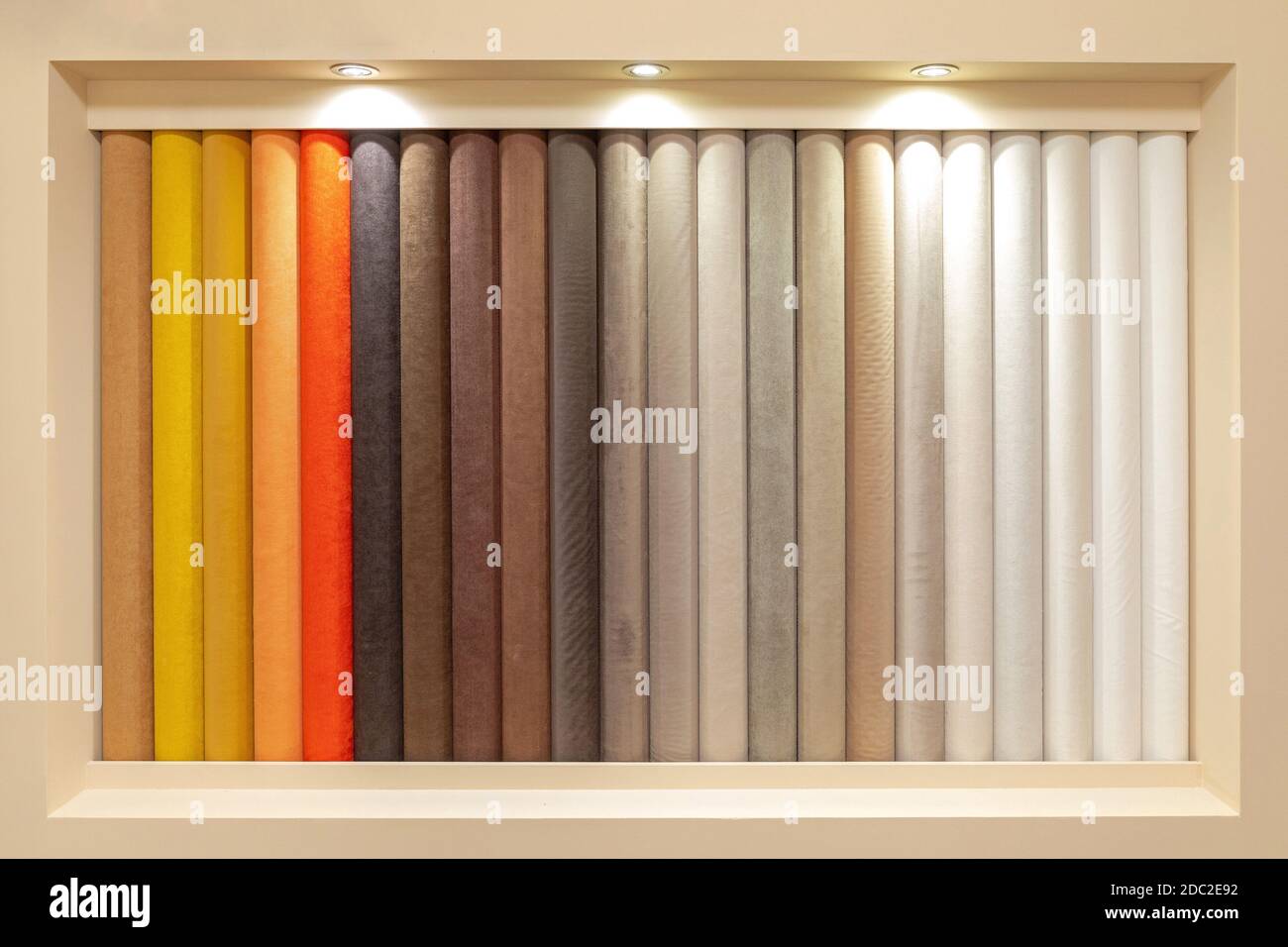 Colour Swatch Textile Material in Rolls at Wall Stock Photo - Alamy