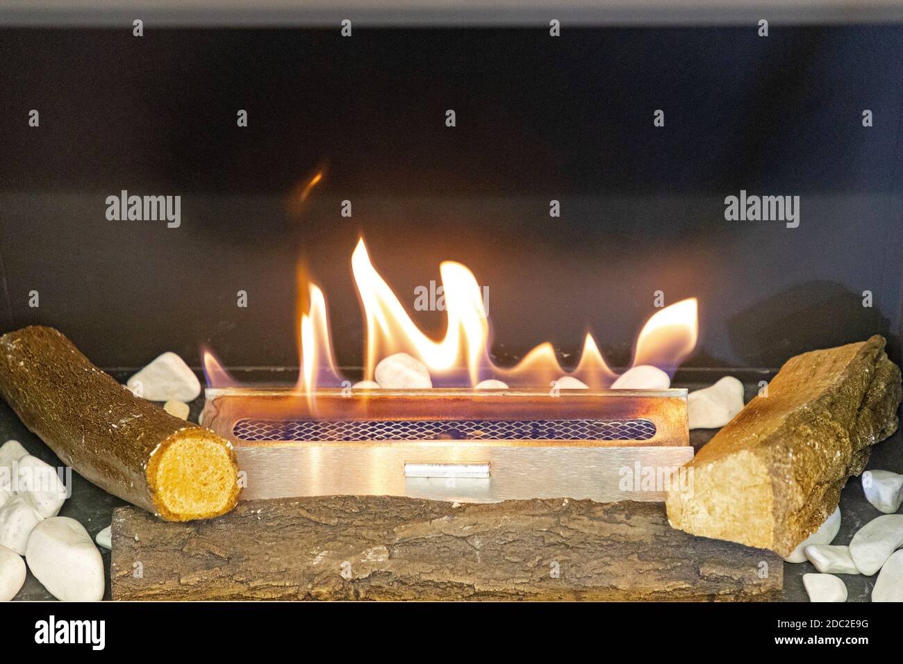 Alcohol burning fireplace ceramic logs hi-res stock photography and ...