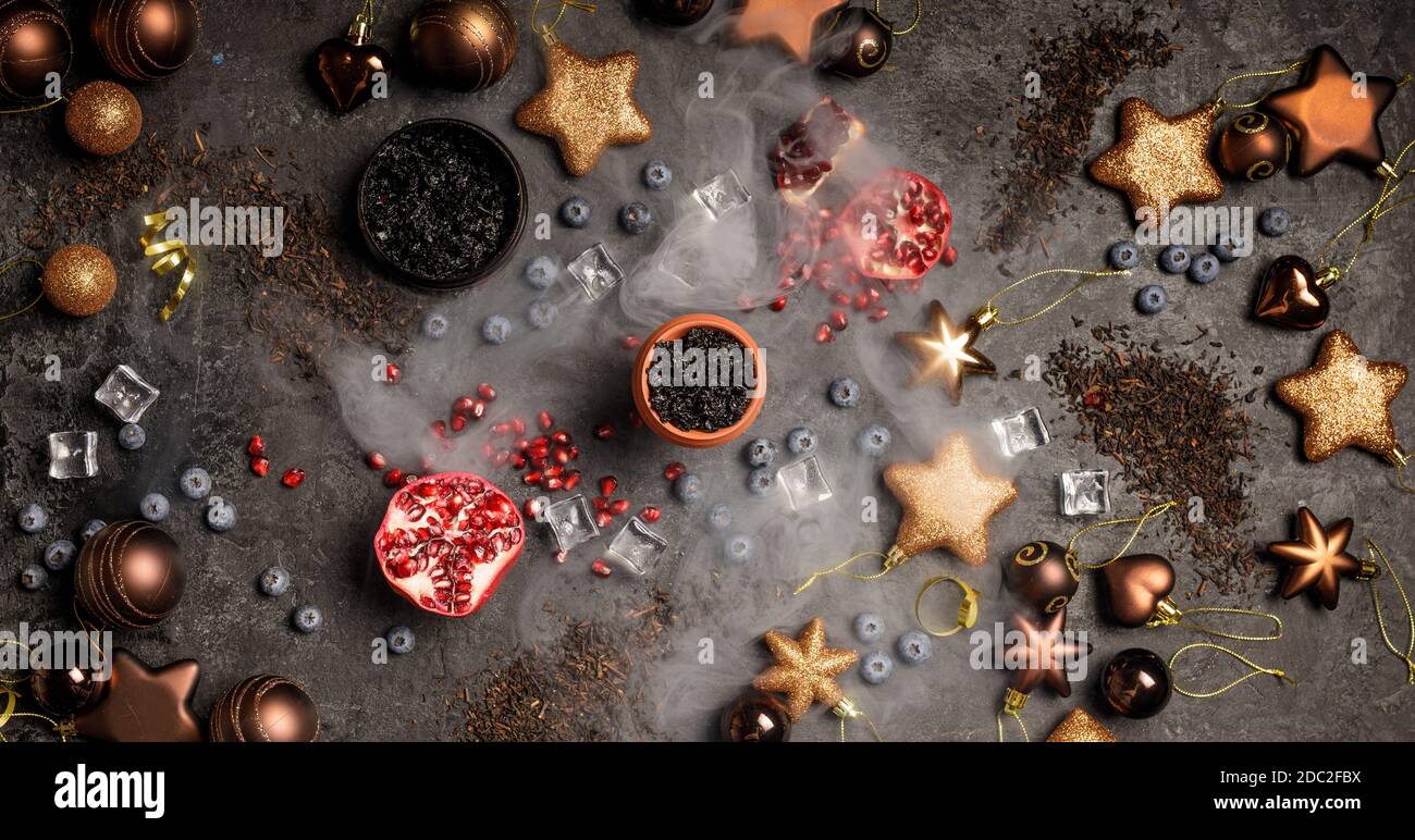 Christmas and hookah concept with glittering ornaments. Hookah ceramic ...