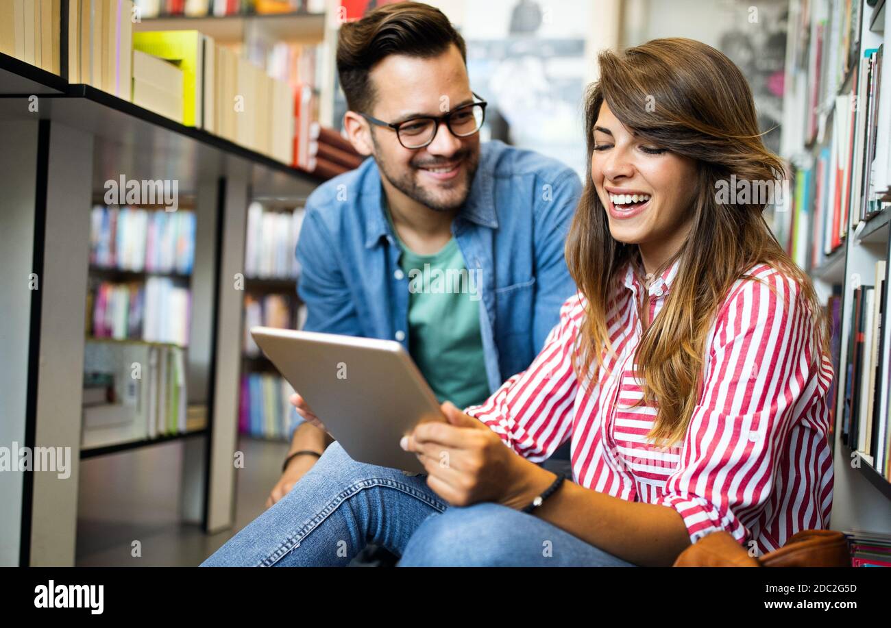Group of college students studying in the school library Stock Photo ...