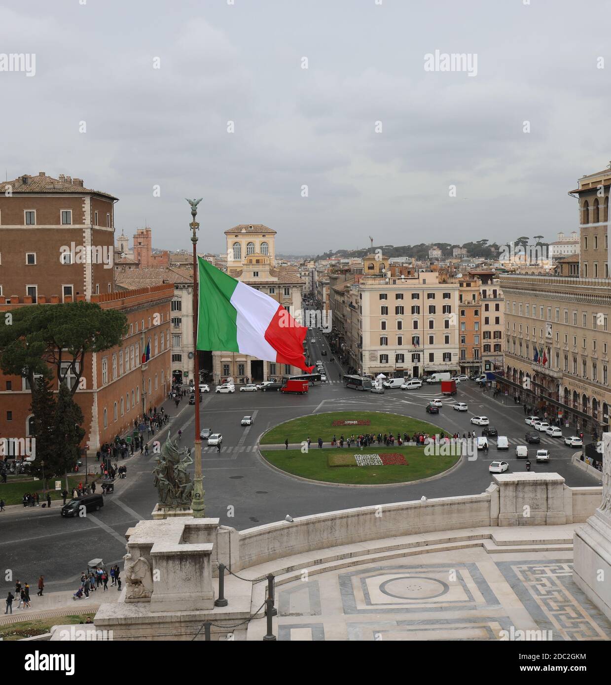 large Italian flag flying from the monument called Vittoriano in Rome ...