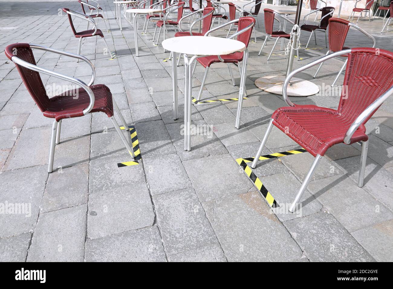 chairs tables spaced to ensure social distancing with tape to highlight ...