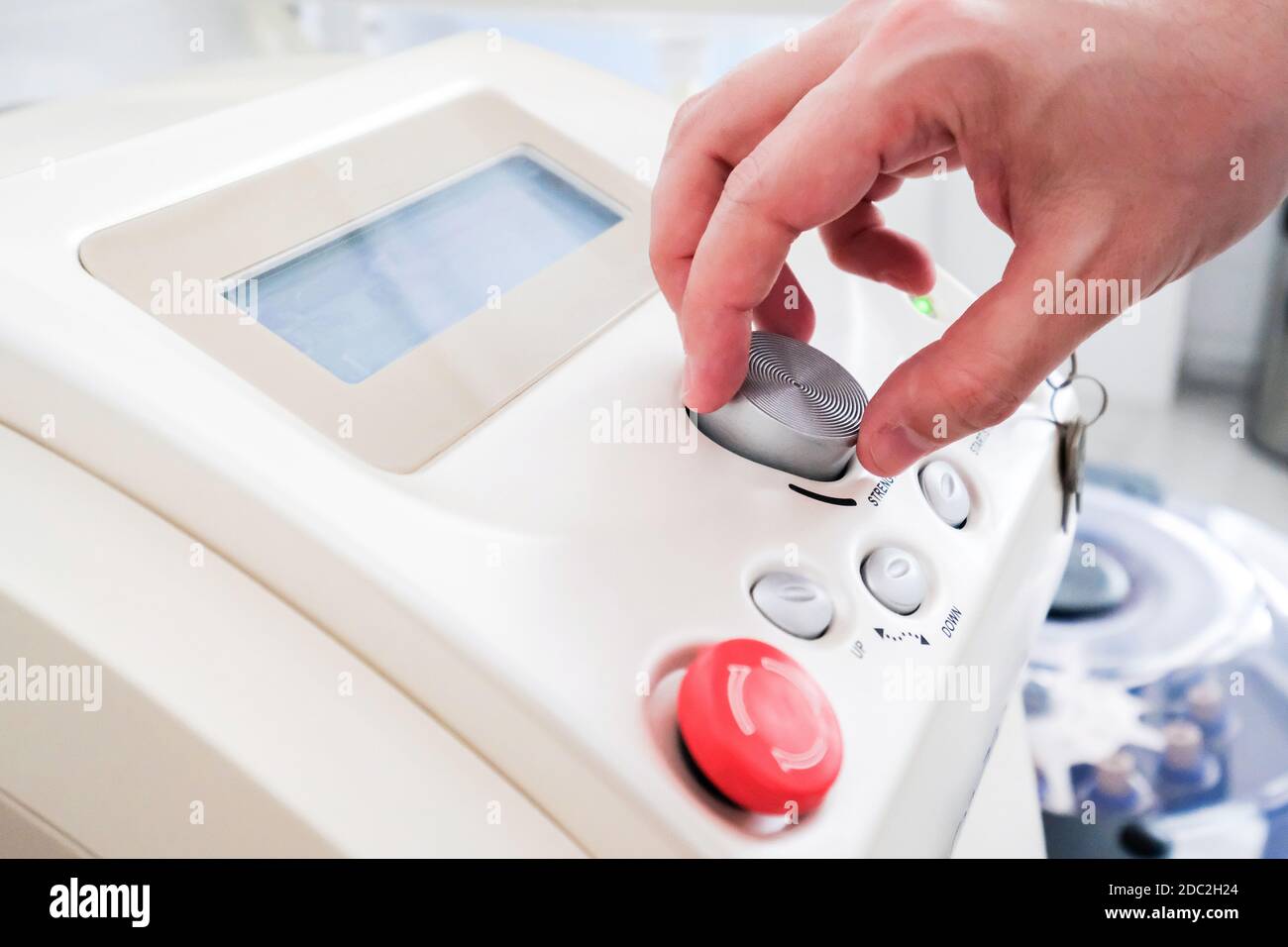 Medical equipment. Remote Control. Man controls the process Stock Photo ...