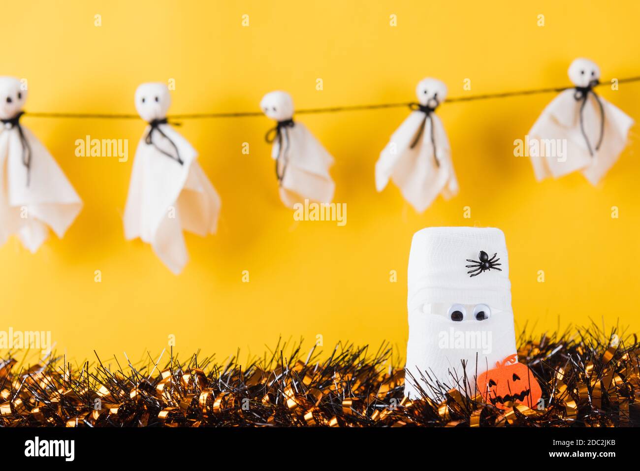 Funny Halloween day decor party concept, The mummy ghost on water glass ...