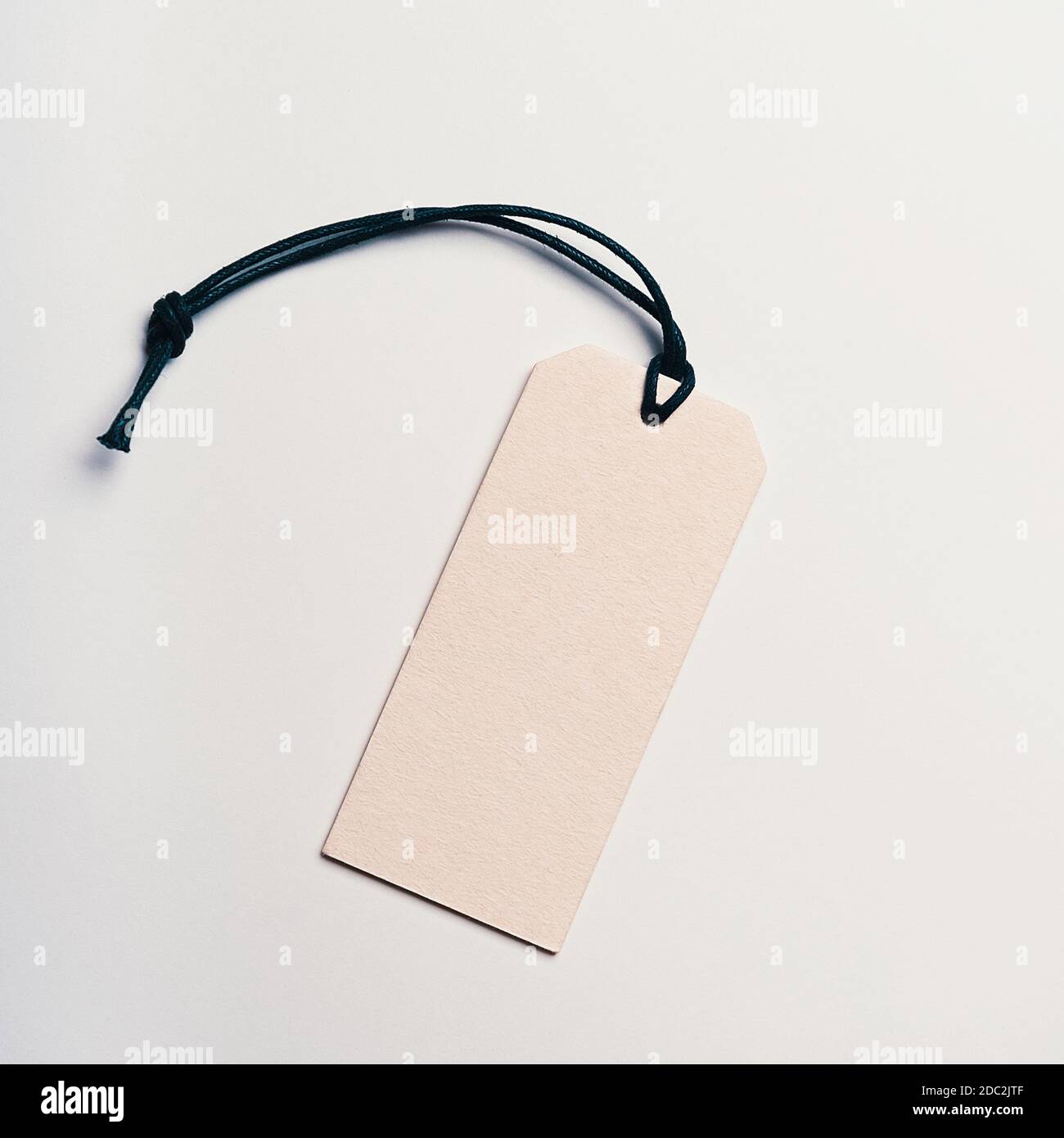 The price tag made of cardboard is empty without inscriptions on a ...
