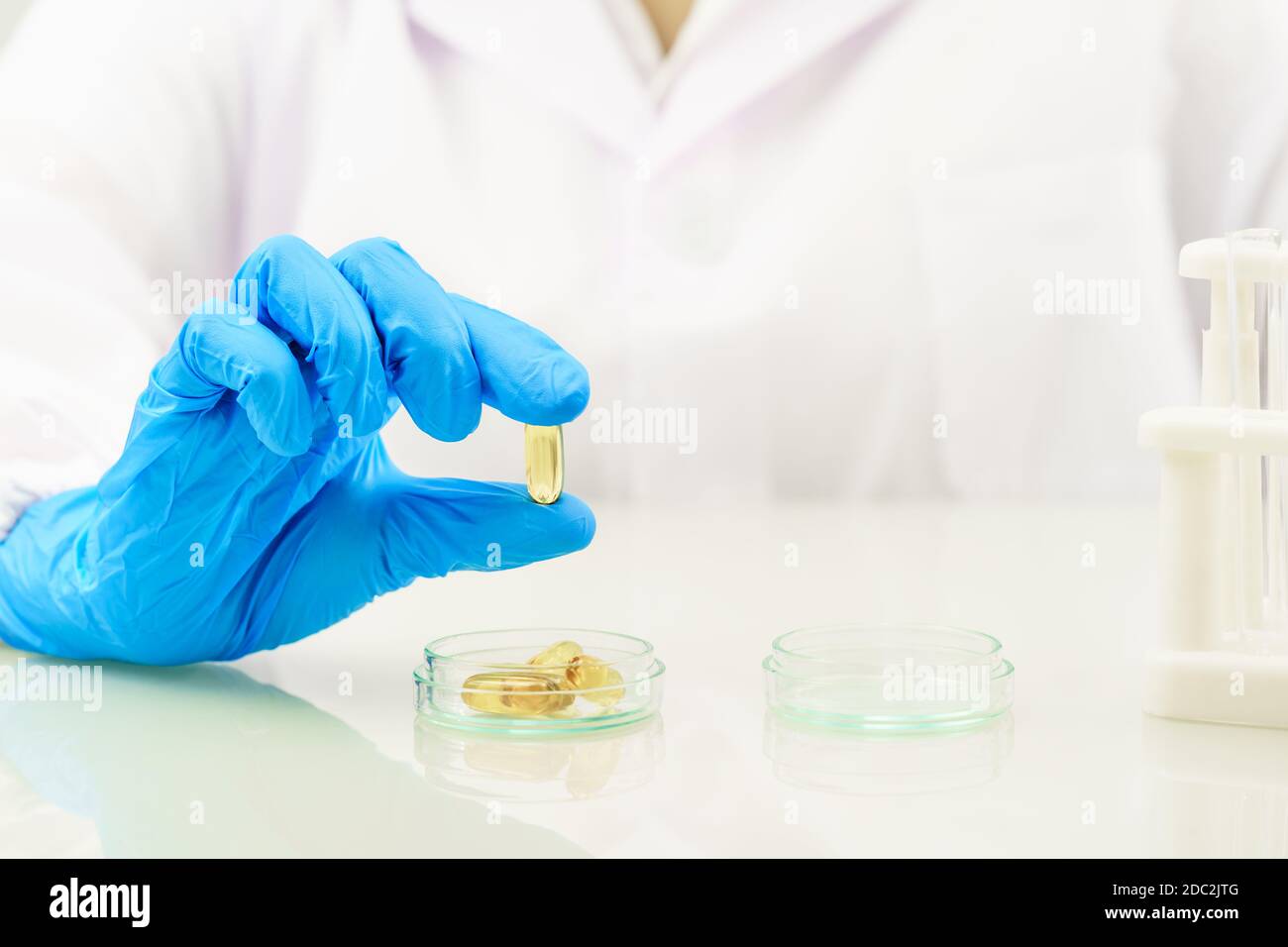 Close up Scientist hands putting in nitrile blue latex gloves holding ...